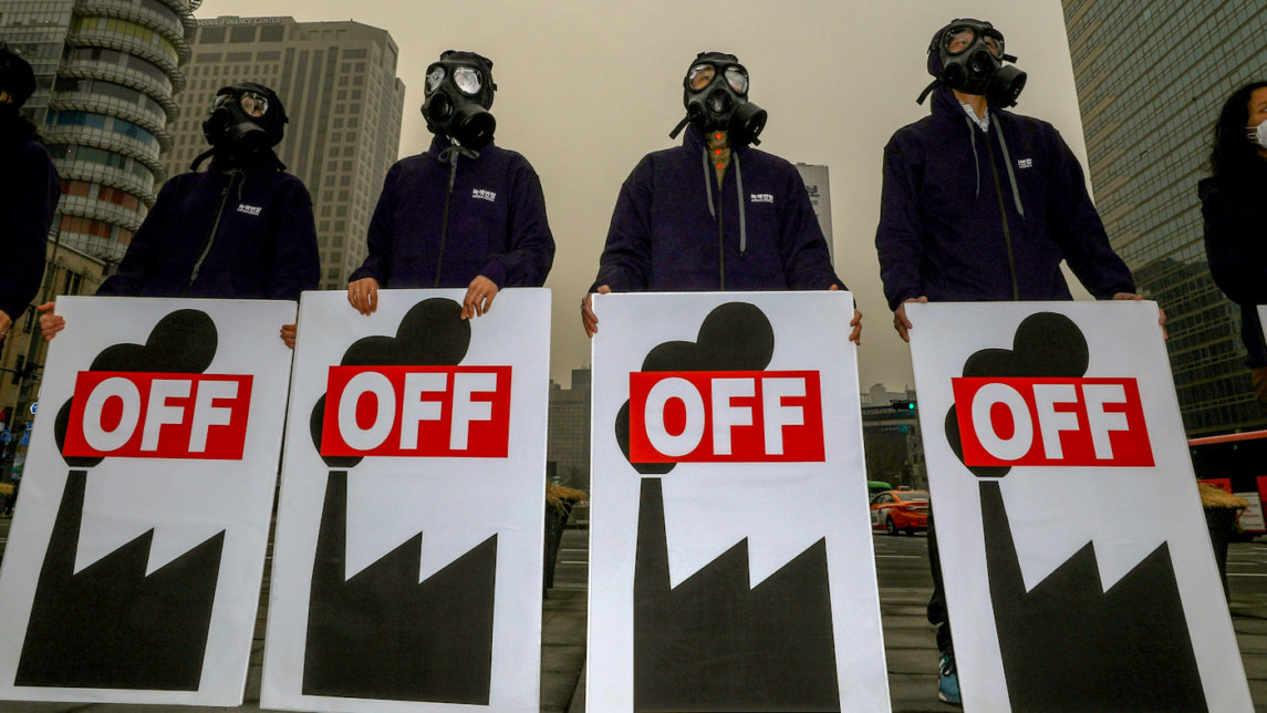 gas masks at a protest over the air pollution problem in Seoul, South Korea