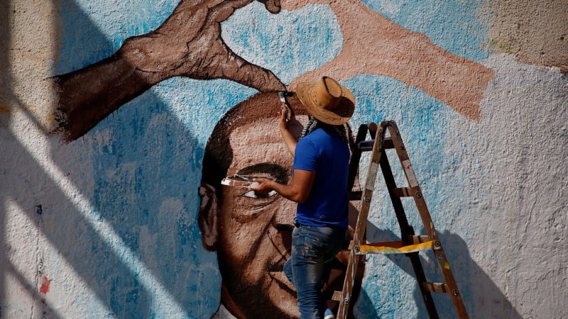 Photo: A, artist paints a mural of George Floyd in Gaza, Palestine